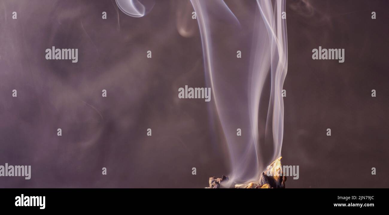 Smoke photographed in the studio with copy space and effect background ...