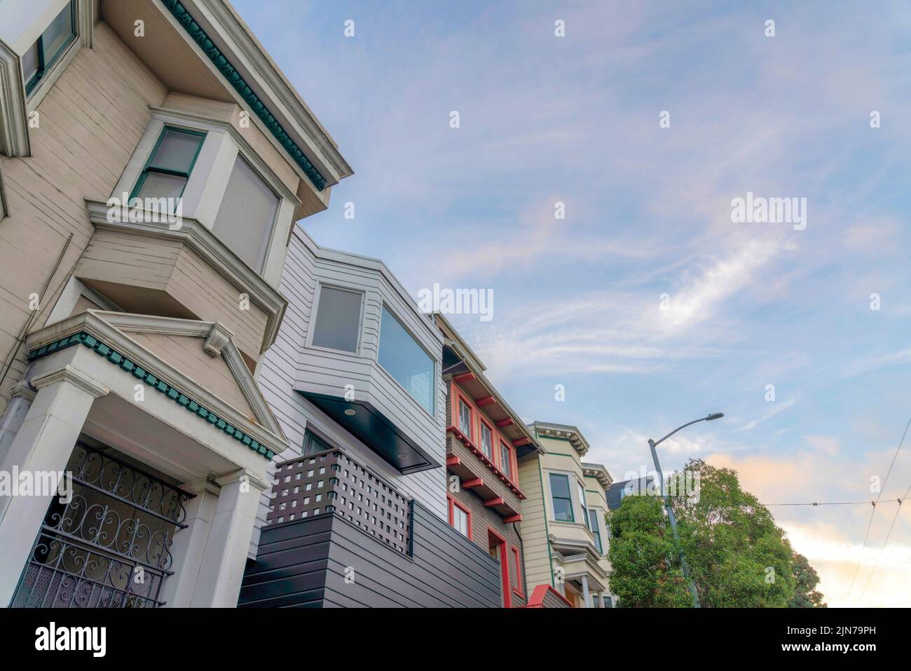 Victorian style suburbs houses in San Francisco, California. Low angle ...