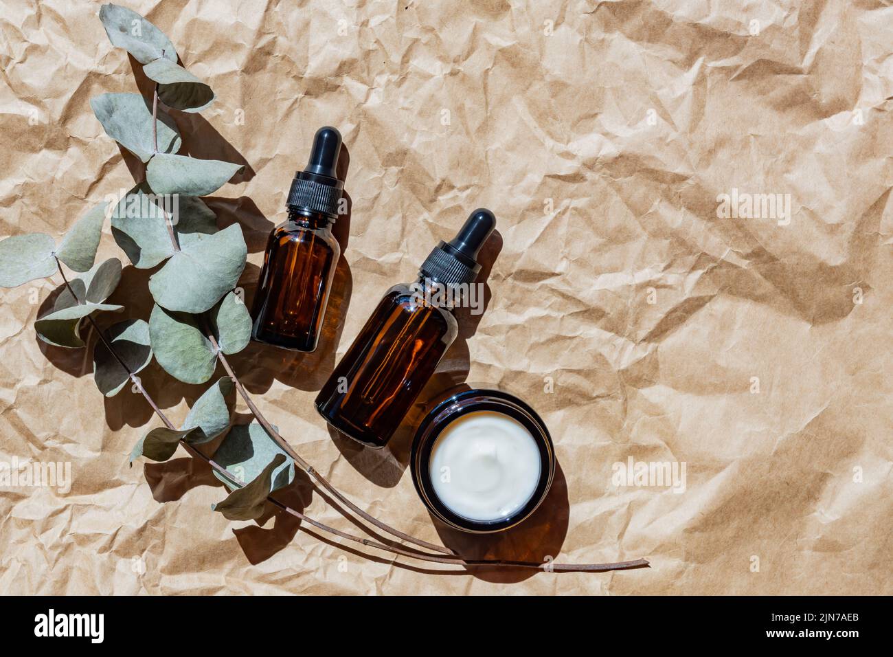 Amber glass dropper bottle with a pippette with black rubber tip and ...