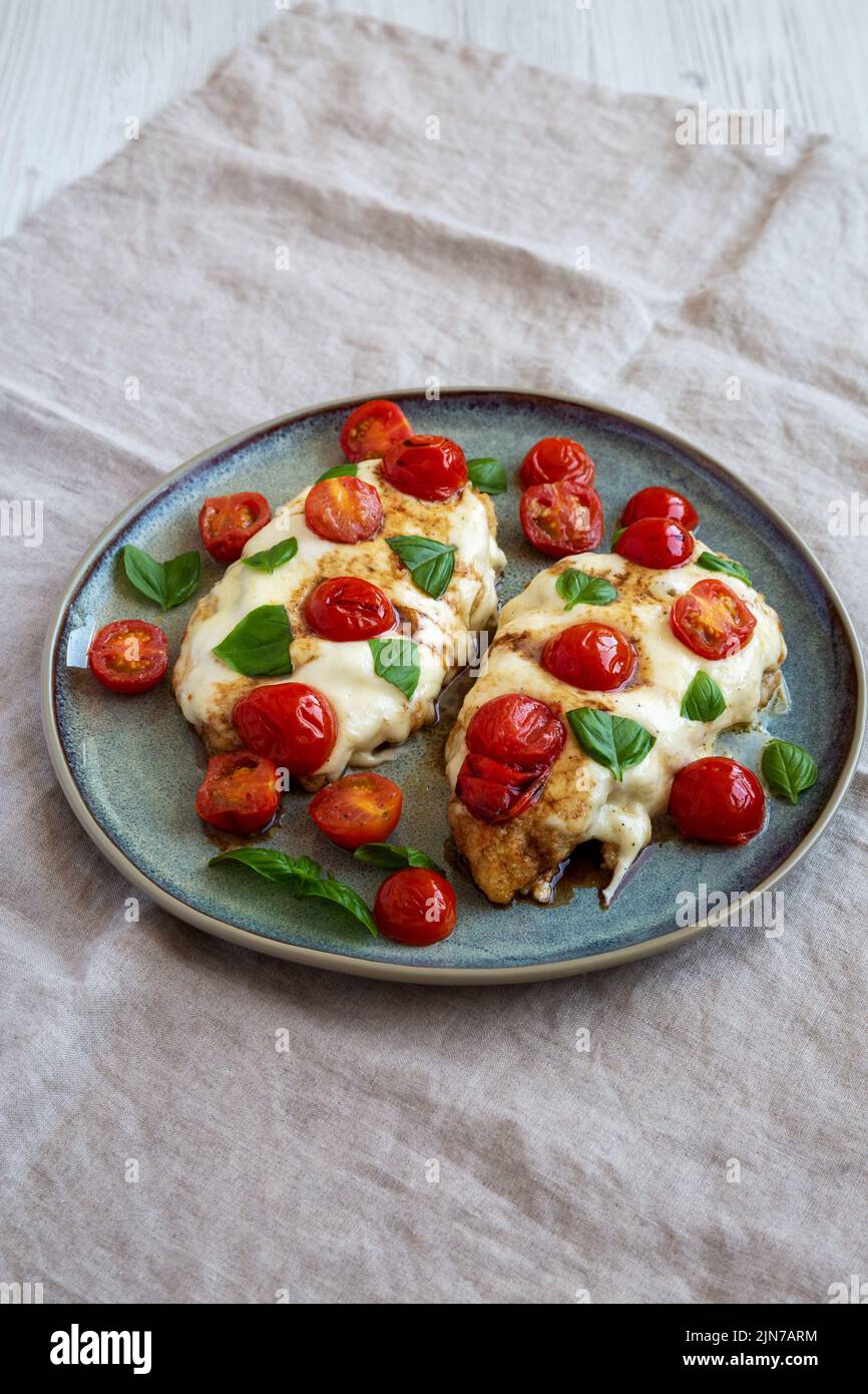 Homemade Caprese Chicken Parmesan with tomato, mozzarella and basil on ...