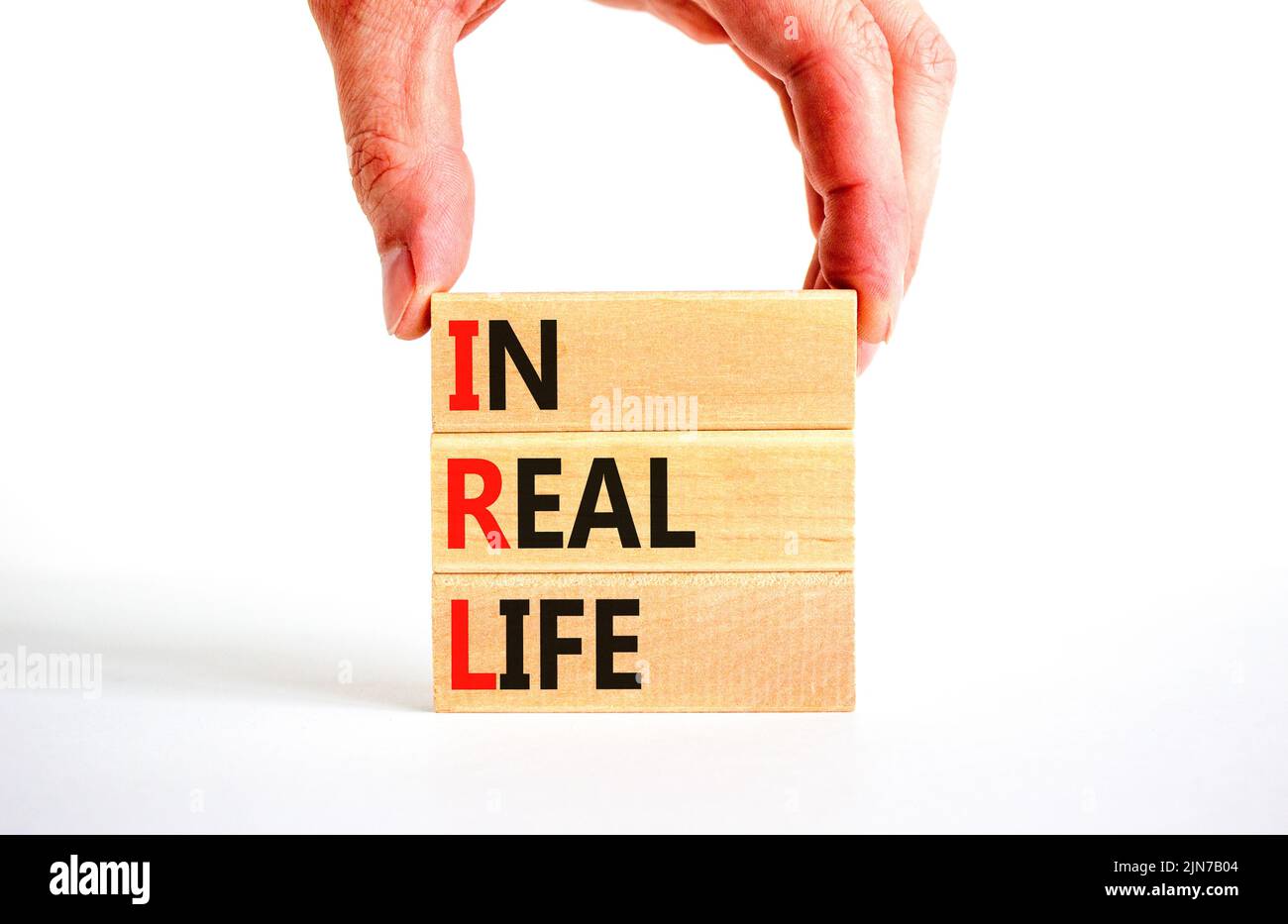 IRL in real life symbol. Concept words IRL in real life on wooden ...