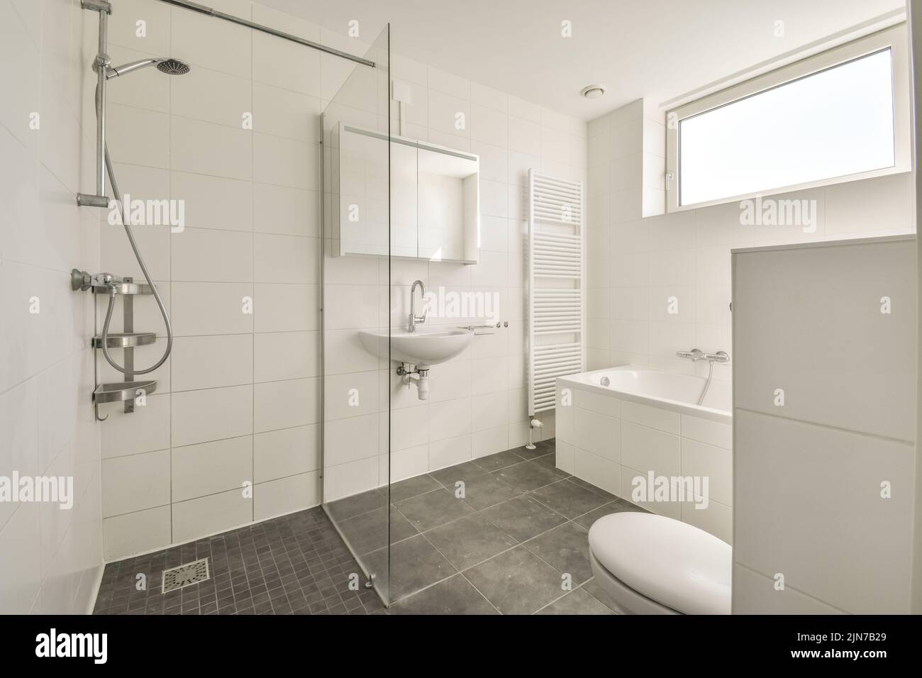 Modern home interior design of white bathroom with open bathtub and ...