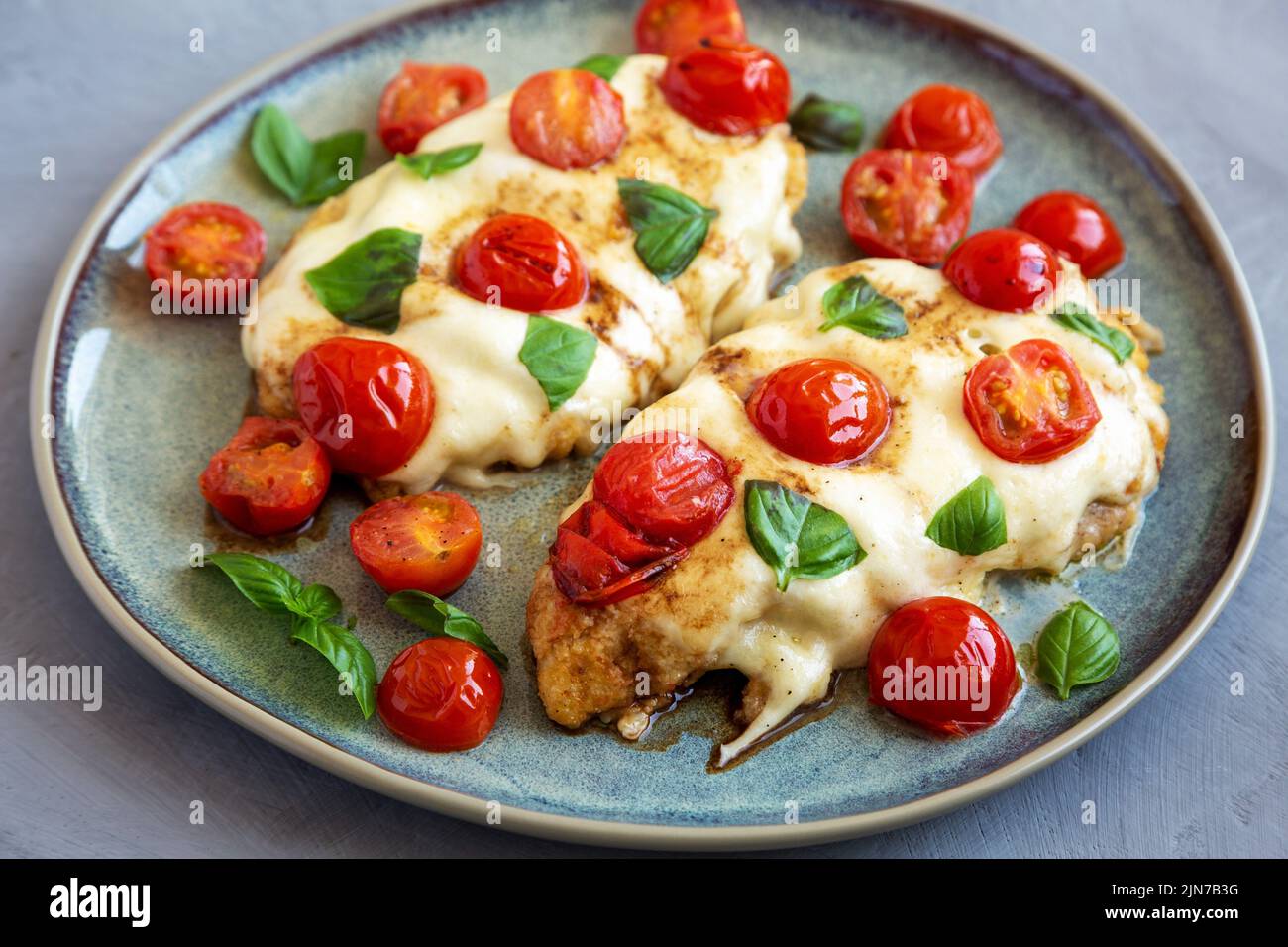 Homemade Caprese Chicken Parmesan with tomato, mozzarella and basil on ...