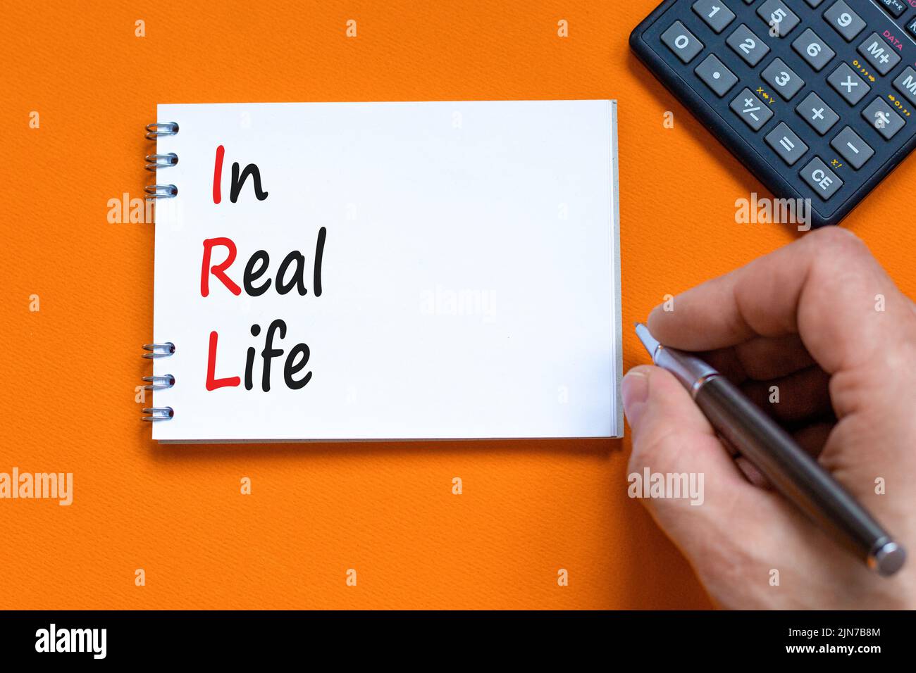 IRL in real life symbol. Concept words IRL in real life on white note ...