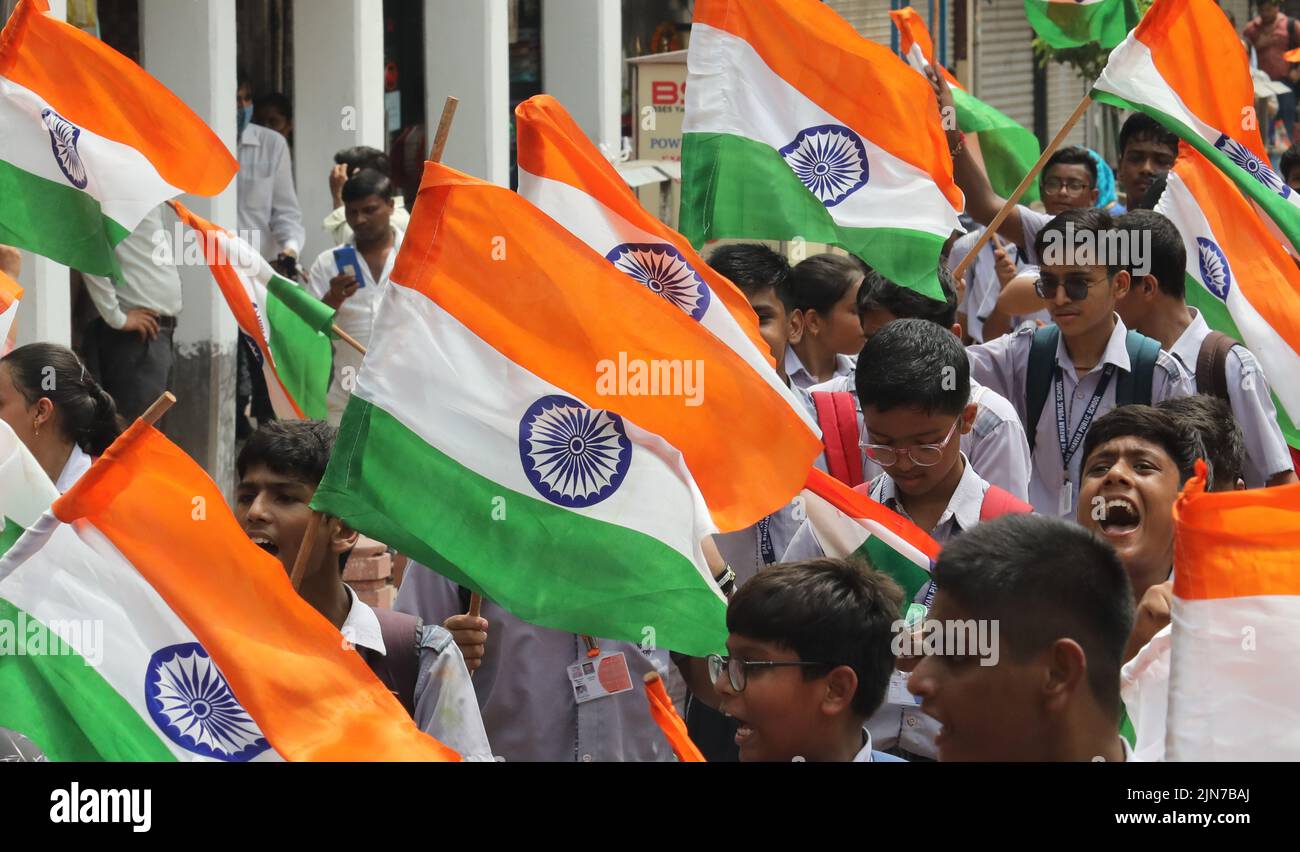New Delhi, India. 09th Aug, 2022. Indian students hold tricolor as they ...