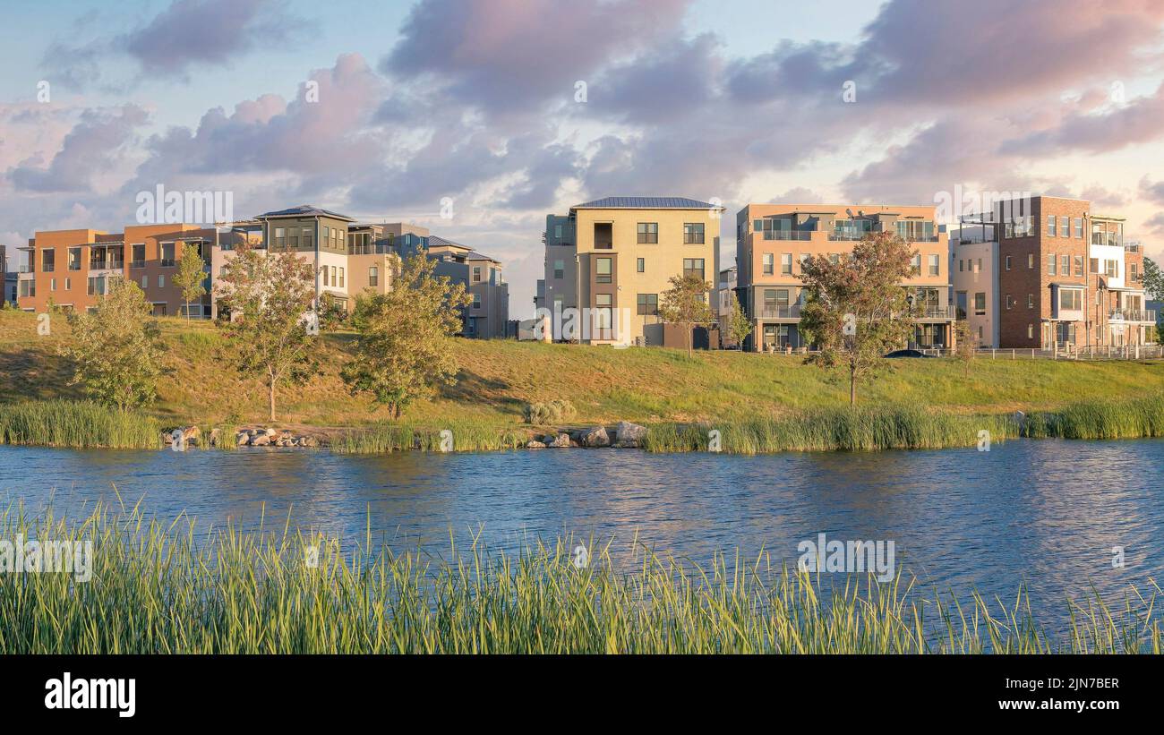 Panorama Puffy clouds at sunset Oquirrh Lake at the front of ...