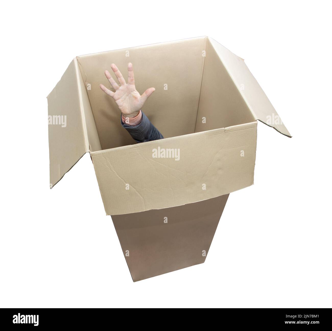 A man's hand raised up in a cardboard box, isolated on white background ...