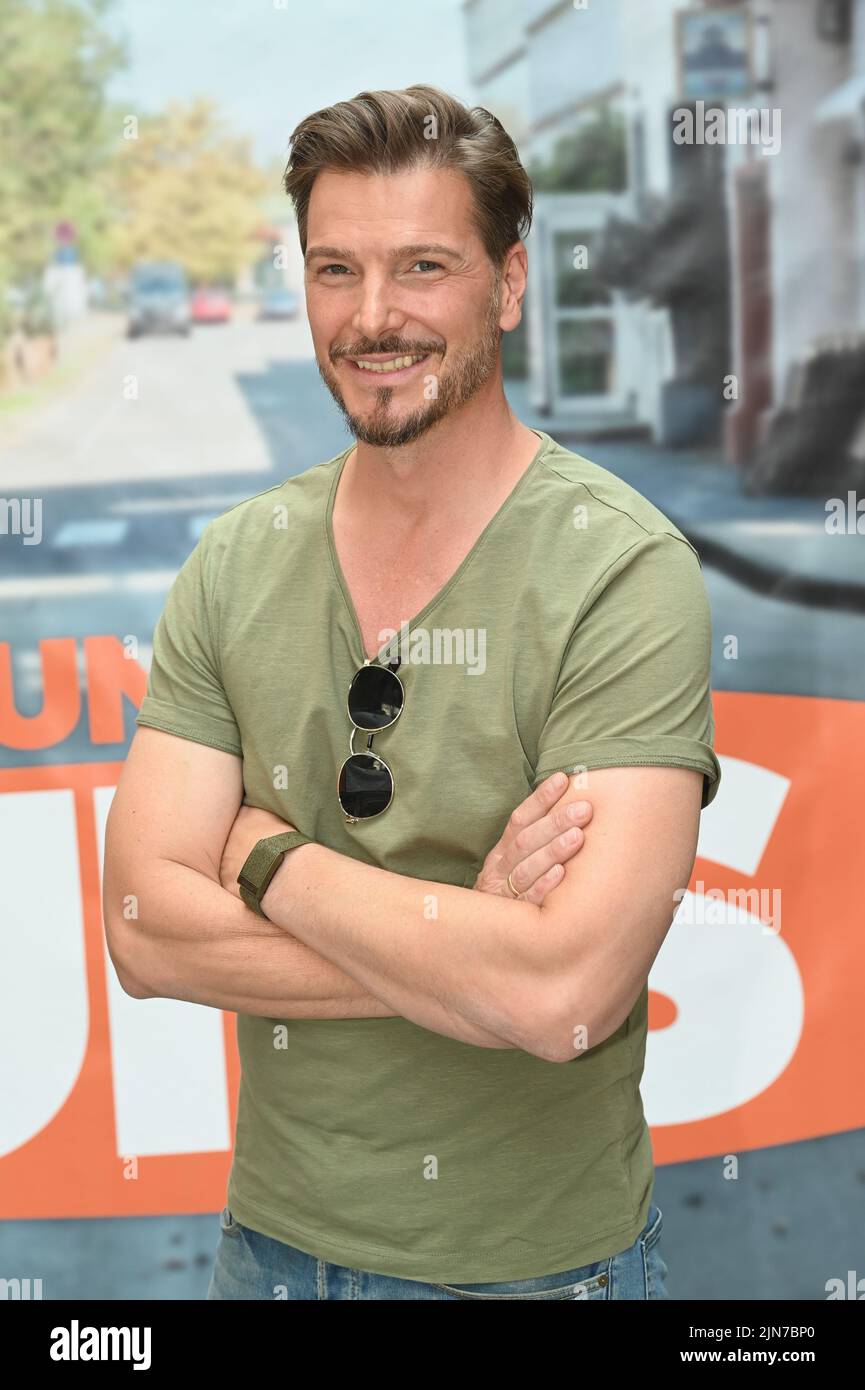 Cologne, Germany. 08th Aug, 2022. Actor Jan Ammann poses at the big fan ...