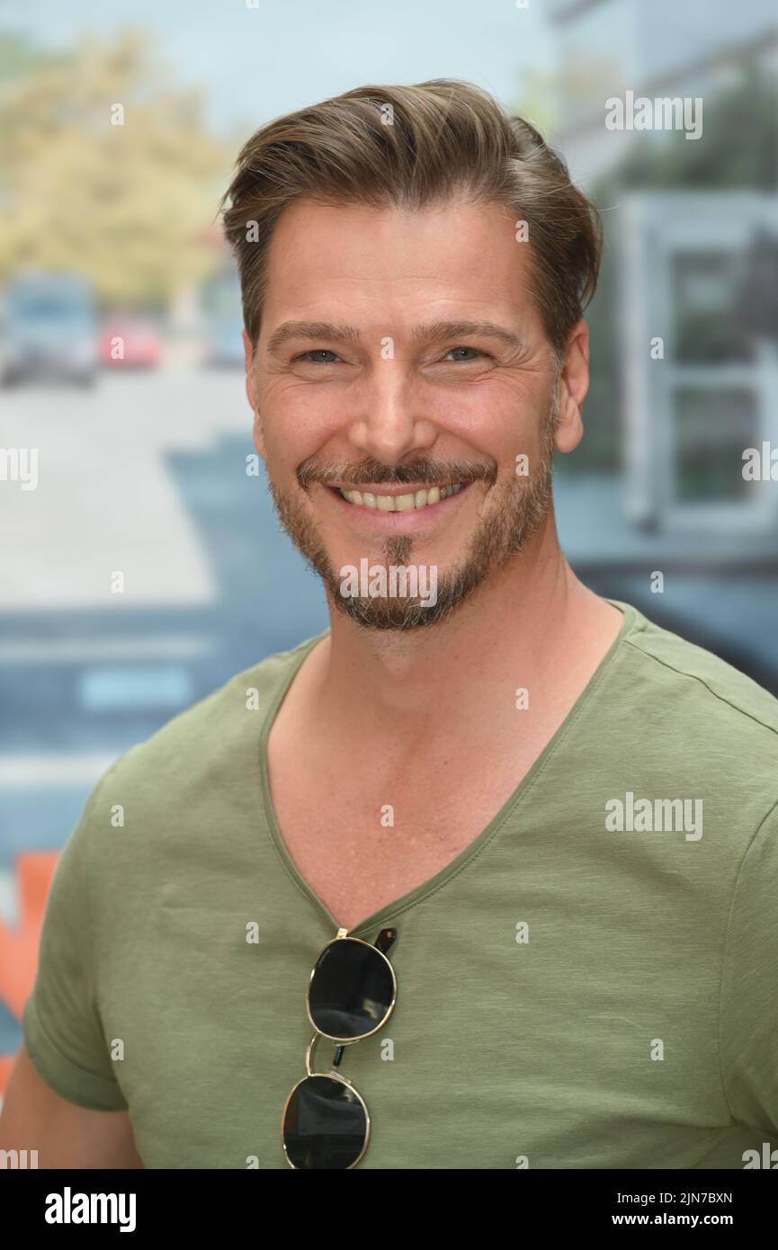 Cologne, Germany. 08th Aug, 2022. Actor Jan Ammann poses at the big fan ...