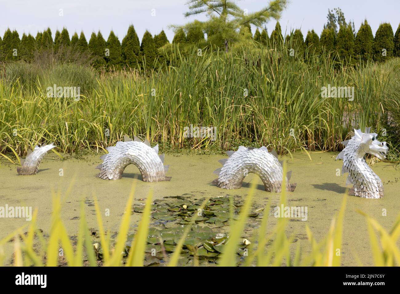 A sea serpent sculpture made of discarded soda cans, on display at the ...