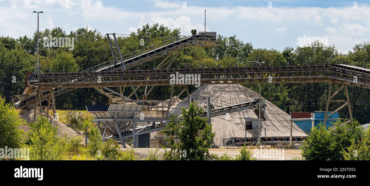 Big machinery and conveyor belts of a gravel and sand industry ...