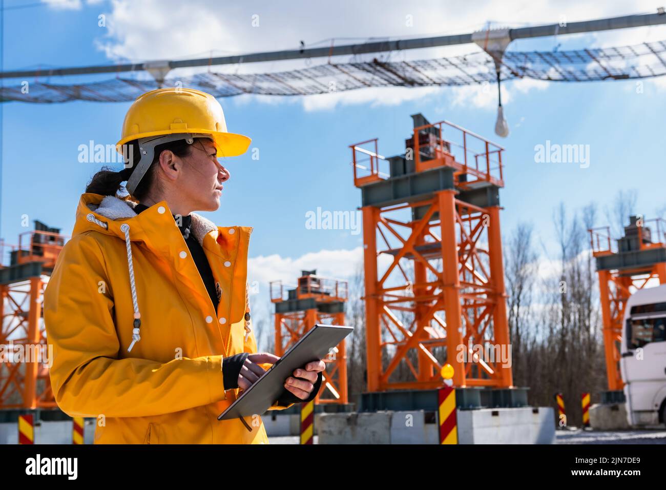 Women engineer at work in constructions with digital tablet ...