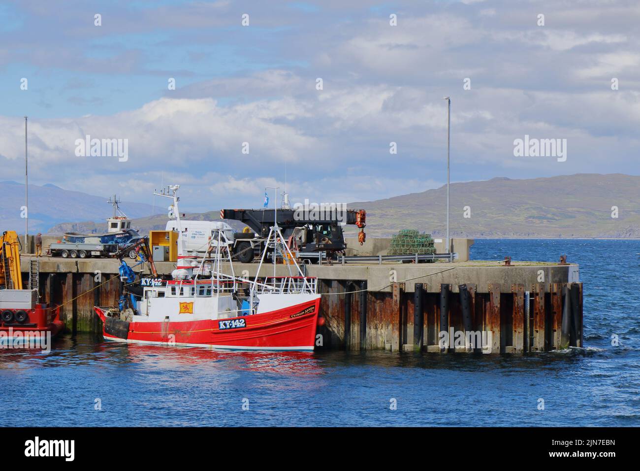 The Crimson Arrow fishing boat, KY142, leaving the bustling and ...