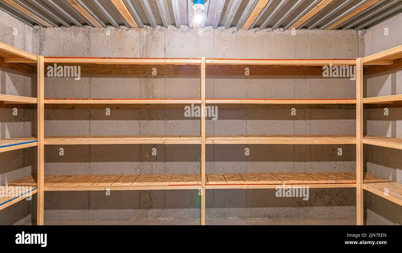 Panorama Unfinished food storage at the basement with concrete walls ...