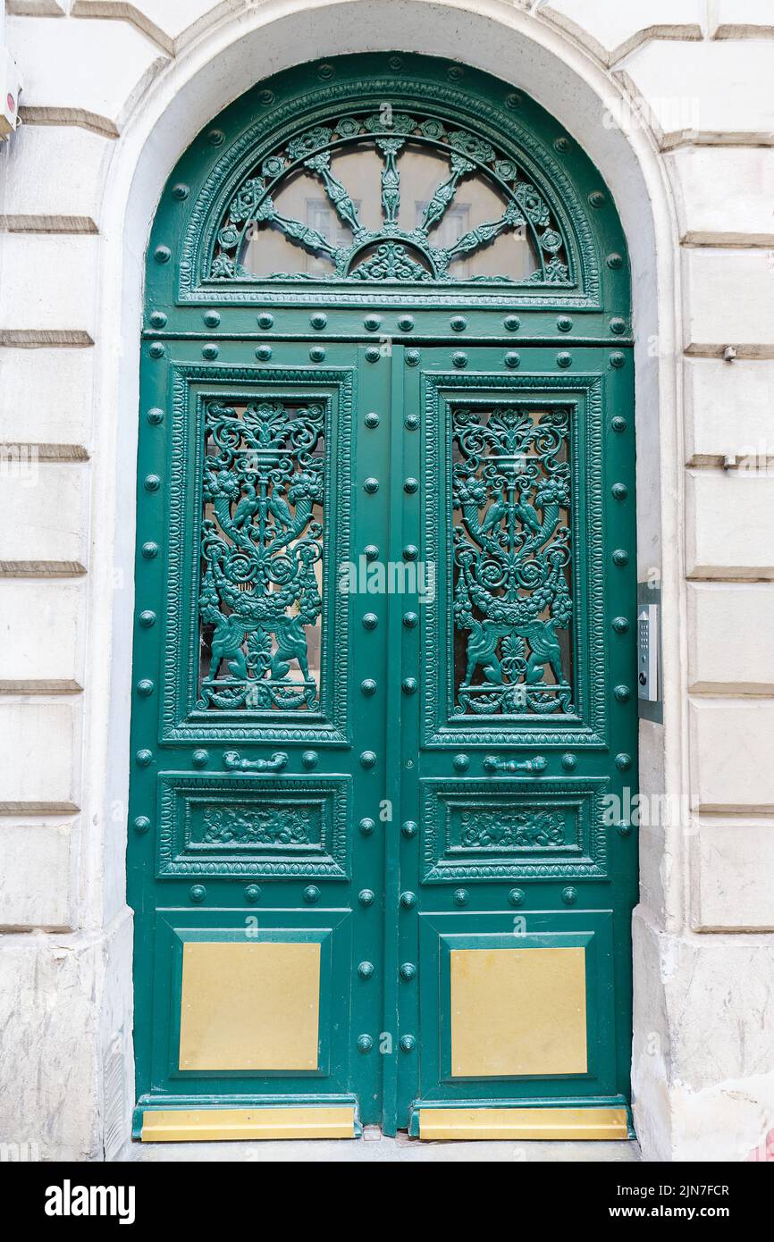 The rich decor decorates an entrance door of the old building of ...