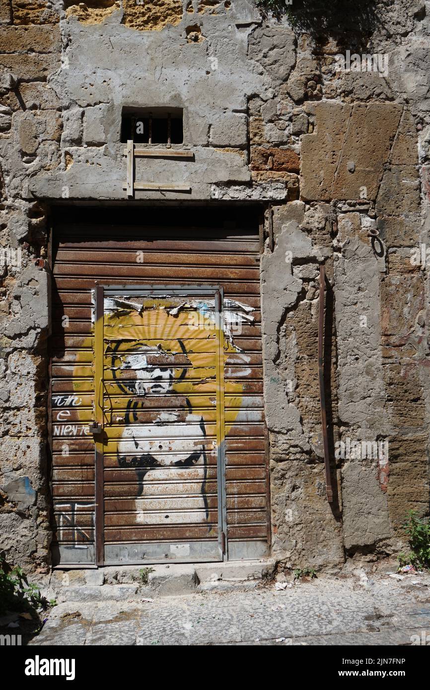 Graffiti on a decaying stone wall Stock Photo - Alamy