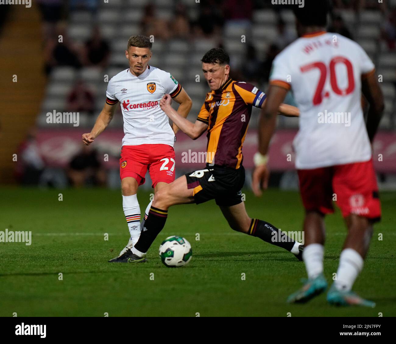 Regan Slater #27 of Hull City plays the ball past Richard Smallwood #6 ...