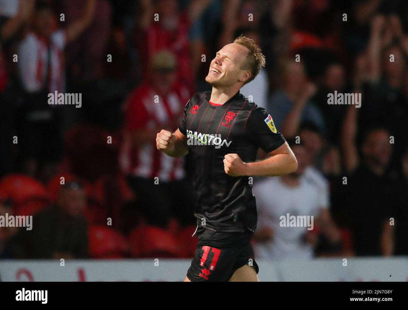 Lincoln City's Anthony Scully celebrates scoring their side's second ...