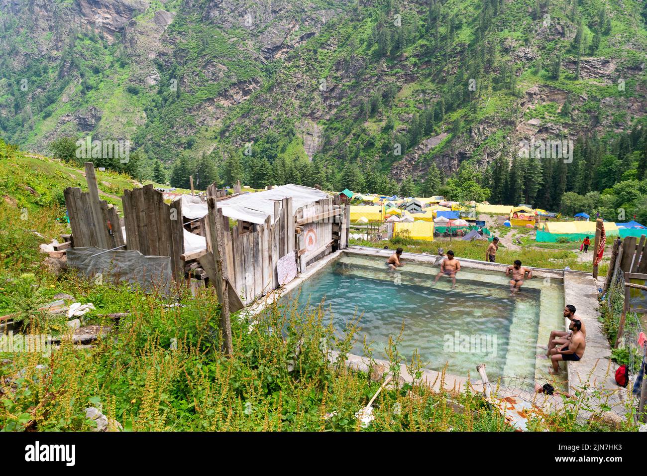A high angle shot of people at Kheer Ganga Hot Water Spring in the ...
