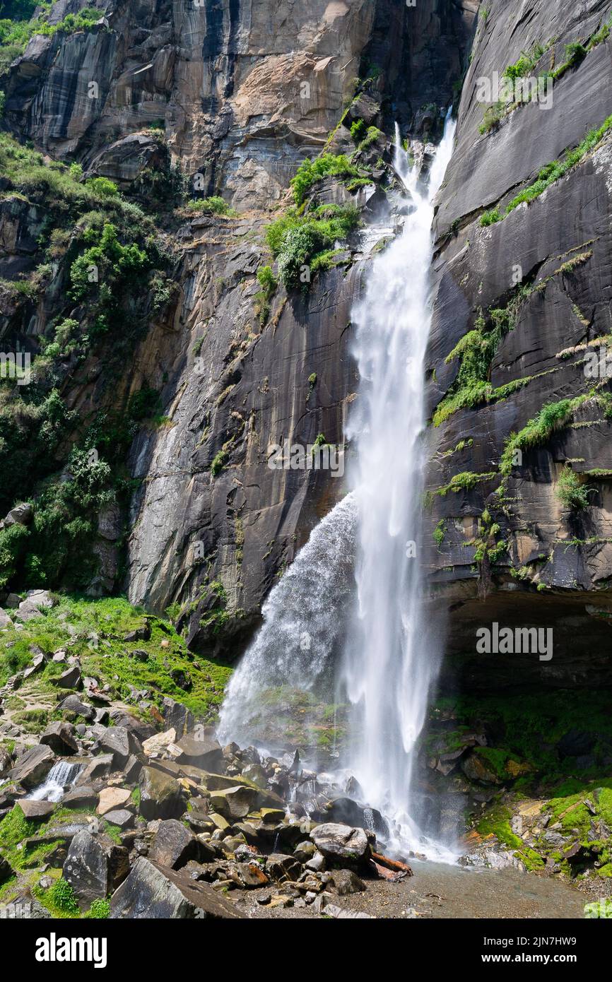 A vertical shot of the Jogini Falls, Manali, Himachal Pradesh, India ...
