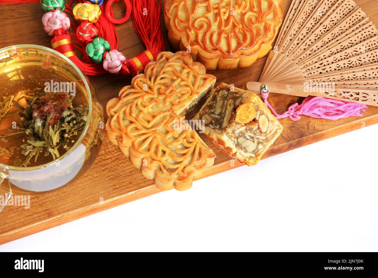 Asia tea time elements: flower tea, moon cake, lucky knot, sandalwood ...