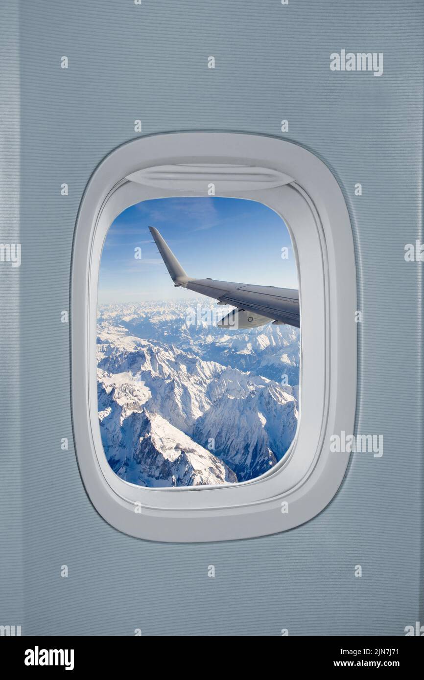 Airplane window with view over the Alps Stock Photo - Alamy
