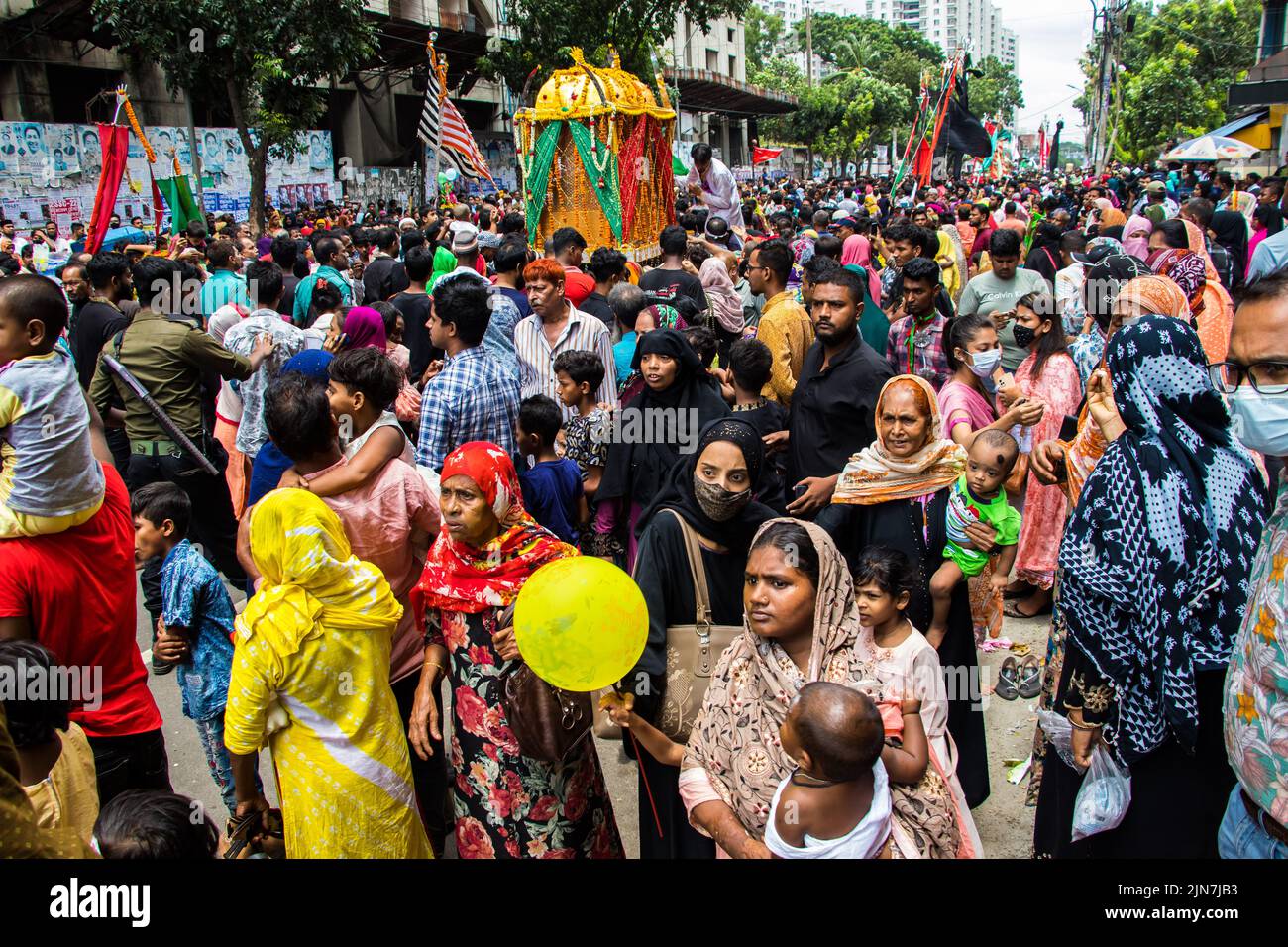 Bangladeshi Shia Muslims march and carry the flags and Tazia during a ...