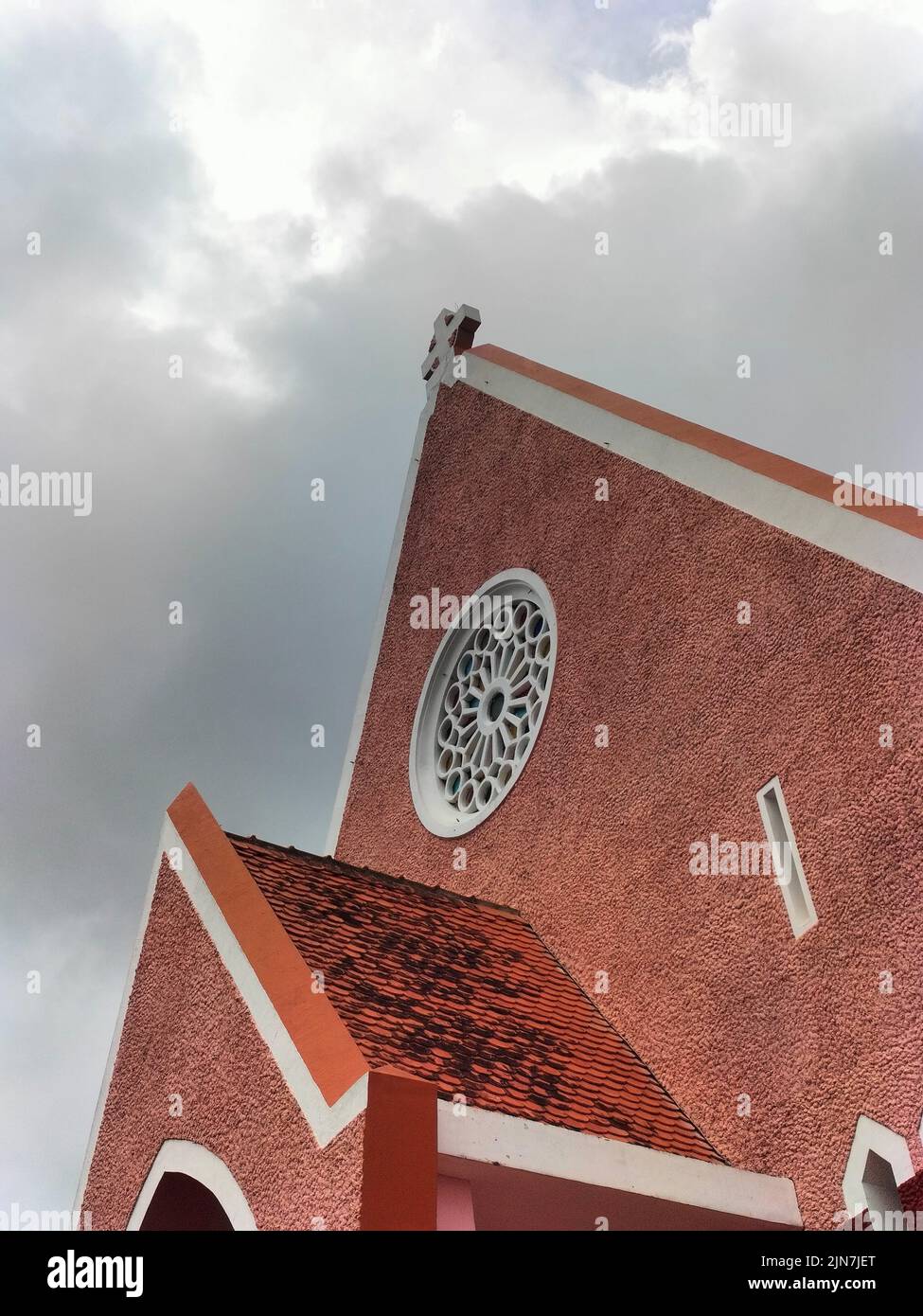 A vertical shot of the facade of the catholic Domaine de Marie church ...