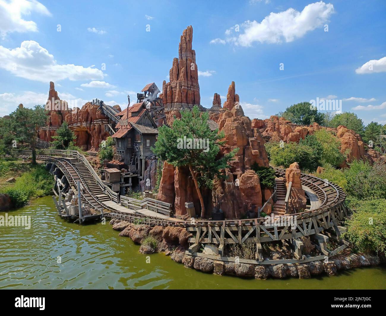 Fantastic roller coaster at the amusement park lake Stock Photo - Alamy