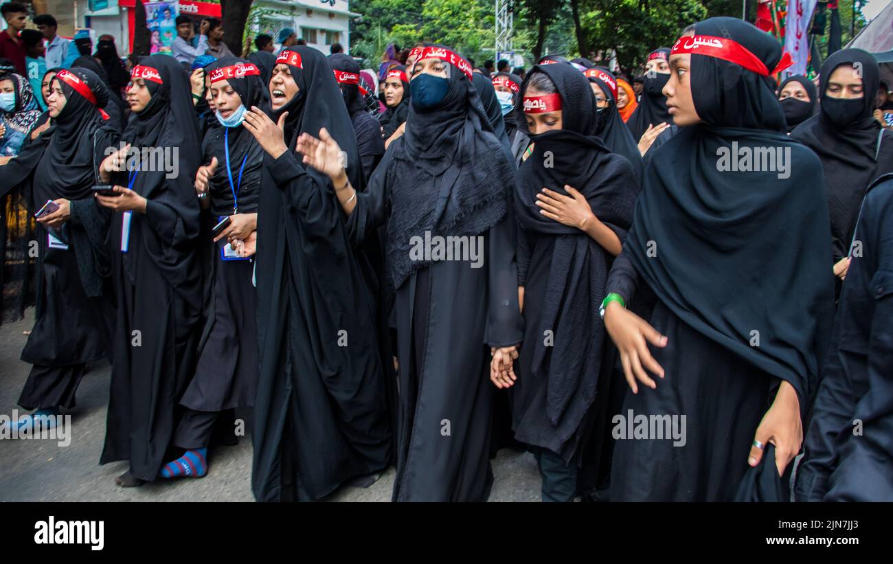 Bangladeshi Shia Muslims march and carry the flags and Tazia during a ...
