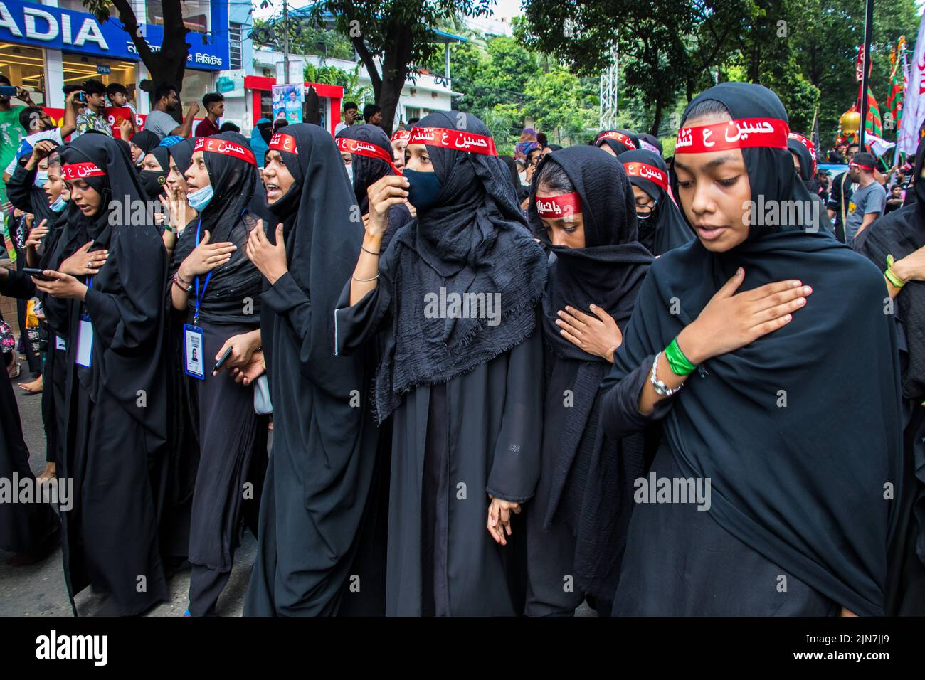 Bangladeshi Shia Muslims march and carry the flags and Tazia during a ...