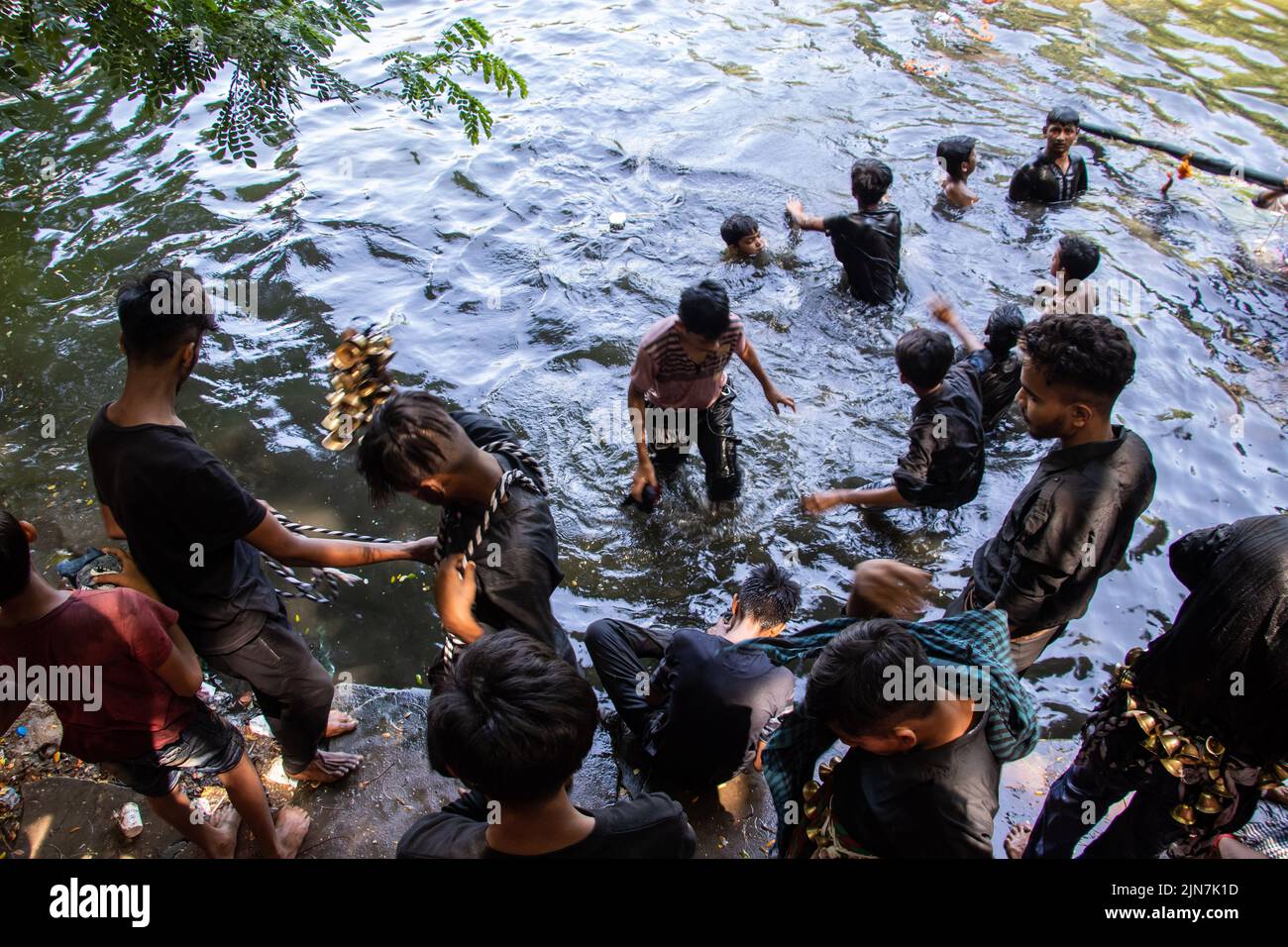 Bangladeshi Shia Muslims march and carry the flags and Tazia during a ...