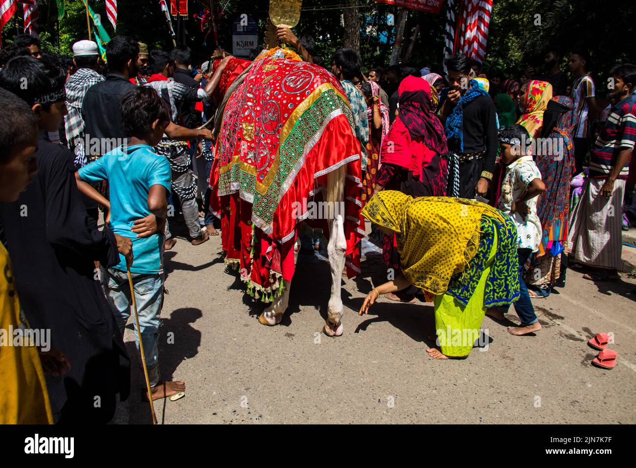 Bangladeshi Shia Muslims march and carry the flags and Tazia during a ...