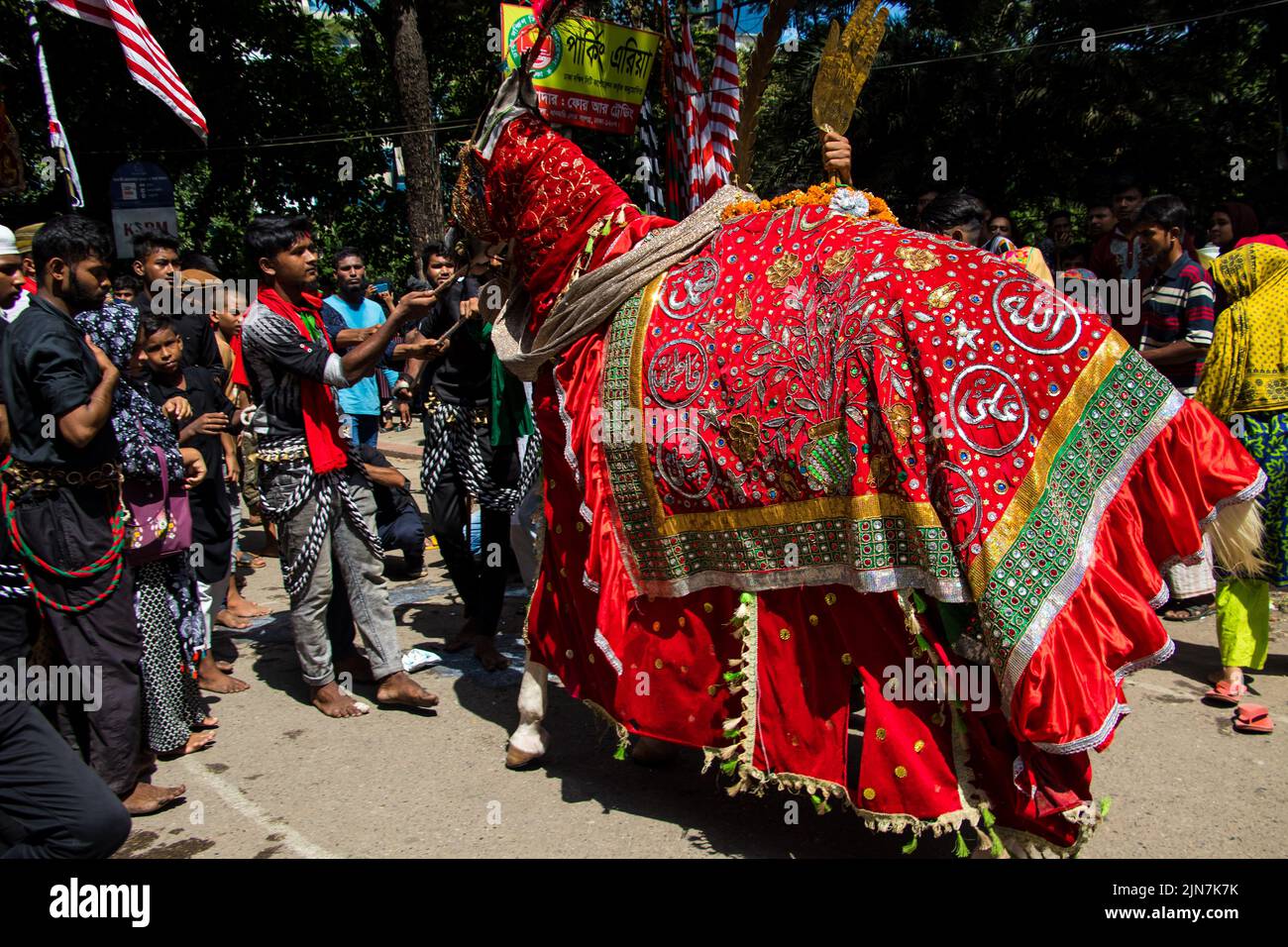 Bangladeshi Shia Muslims march and carry the flags and Tazia during a ...