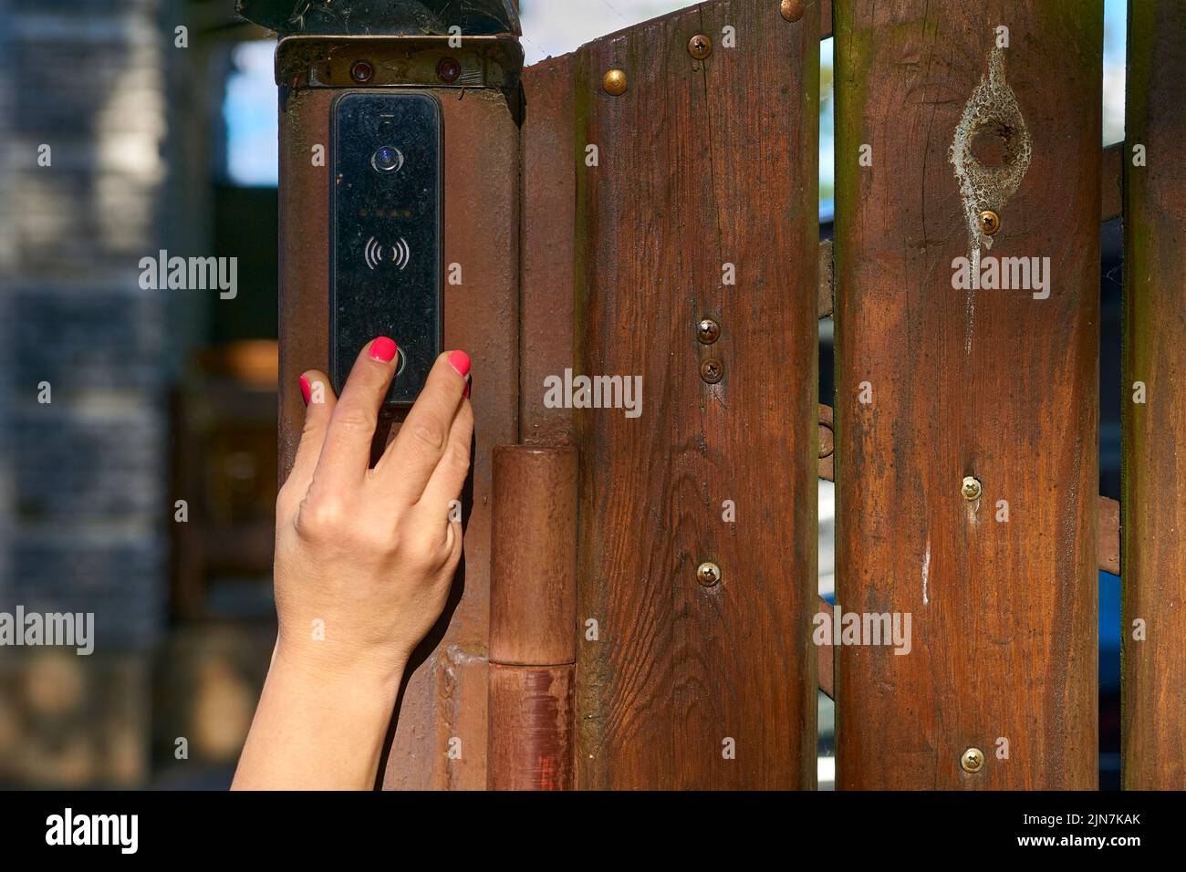 Womans hand ringing doorbell hi-res stock photography and images - Alamy