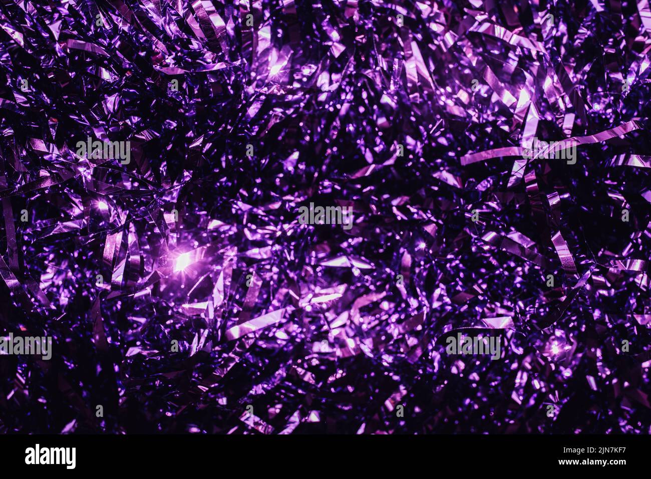 Sparkling, sparkly purple tinsel background texture Stock Photo - Alamy
