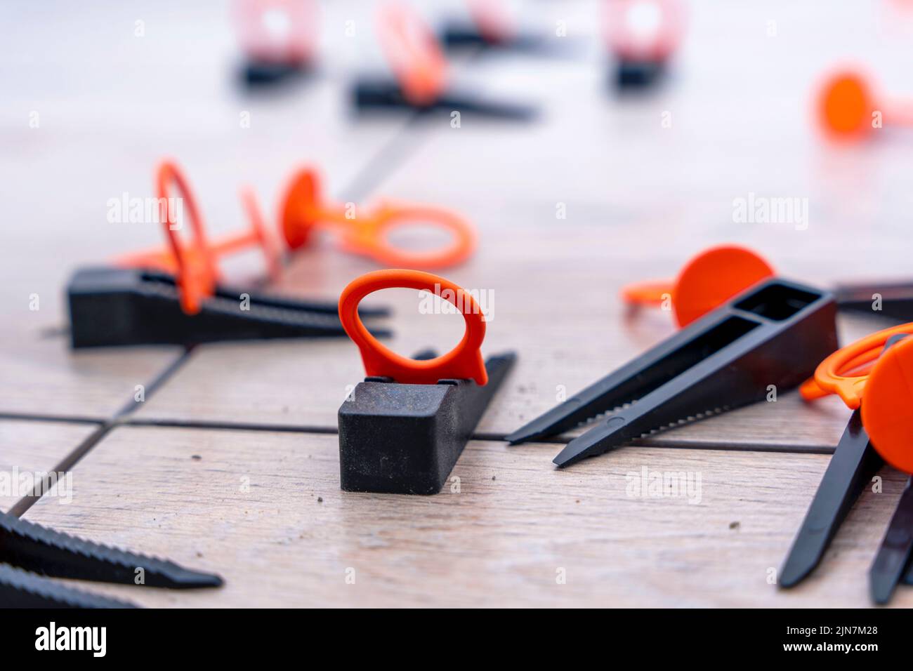 close-up of the tile alignment system holding tile in given position ...