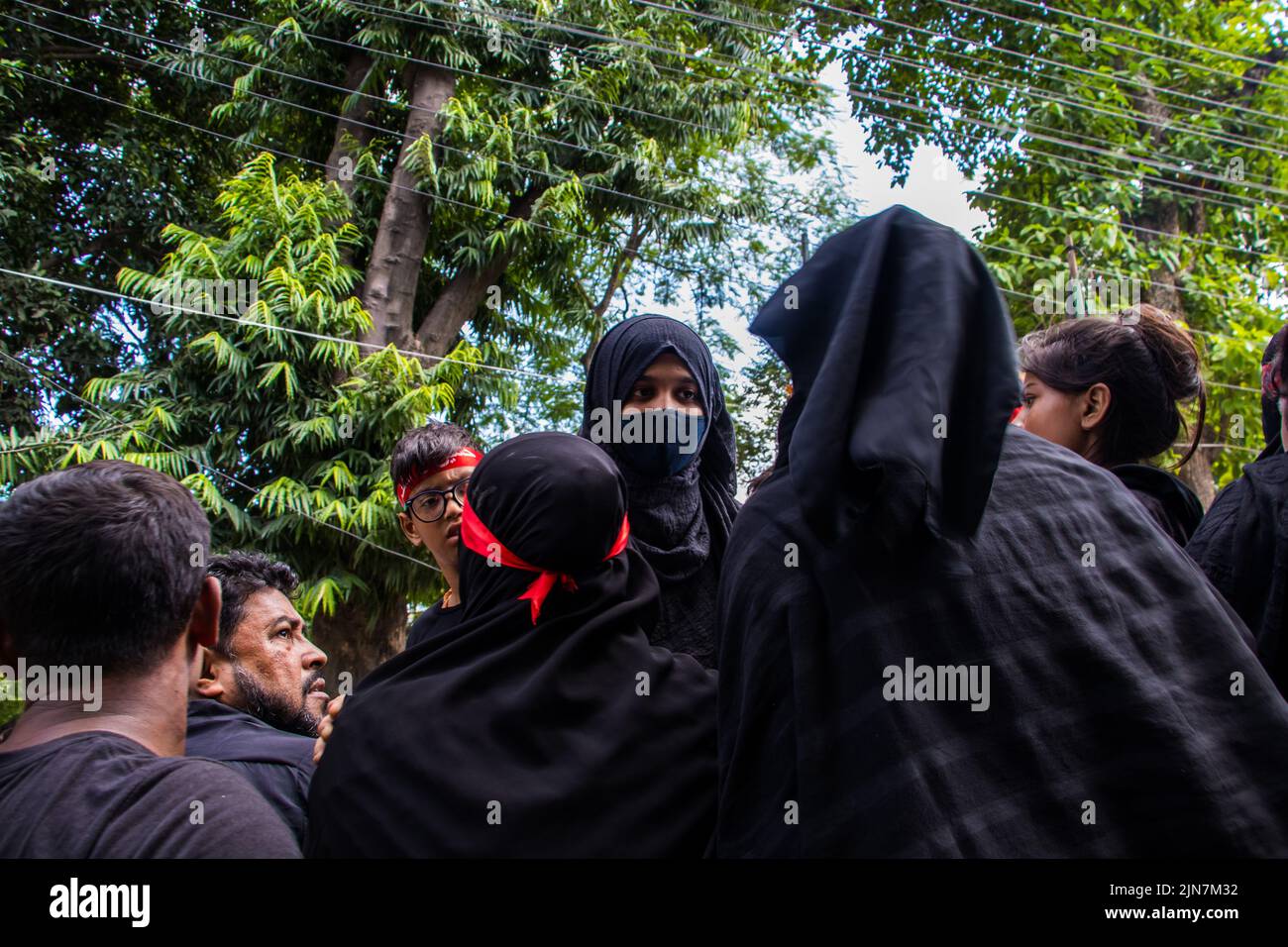 Bangladeshi Shia Muslims march and carry the flags and Tazia during a ...