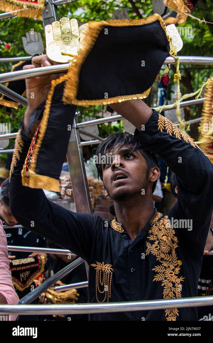 Bangladeshi Shia Muslims march and carry the flags and Tazia during a ...