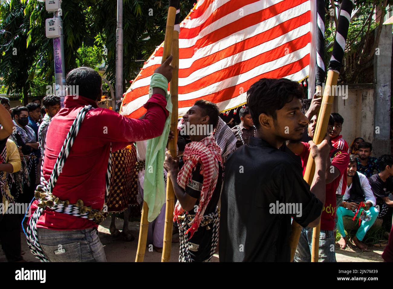 Bangladeshi Shia Muslims march and carry the flags and Tazia during a ...