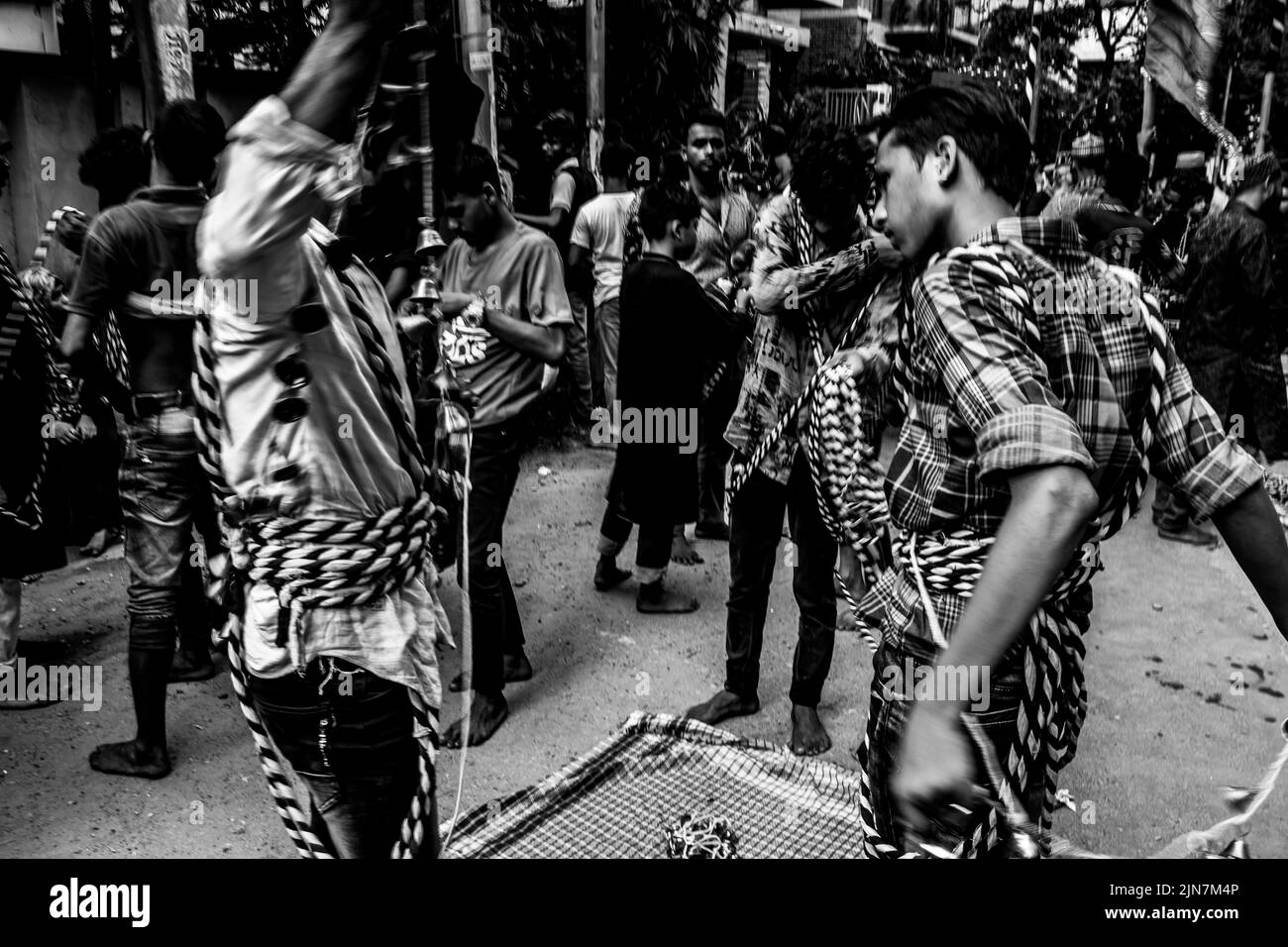 Bangladeshi Shia Muslims march and carry the flags and Tazia during a ...