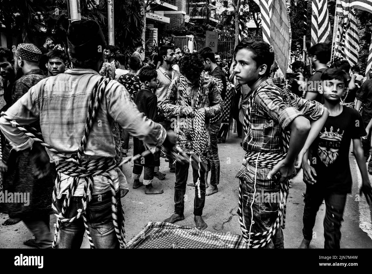 Bangladeshi Shia Muslims march and carry the flags and Tazia during a ...