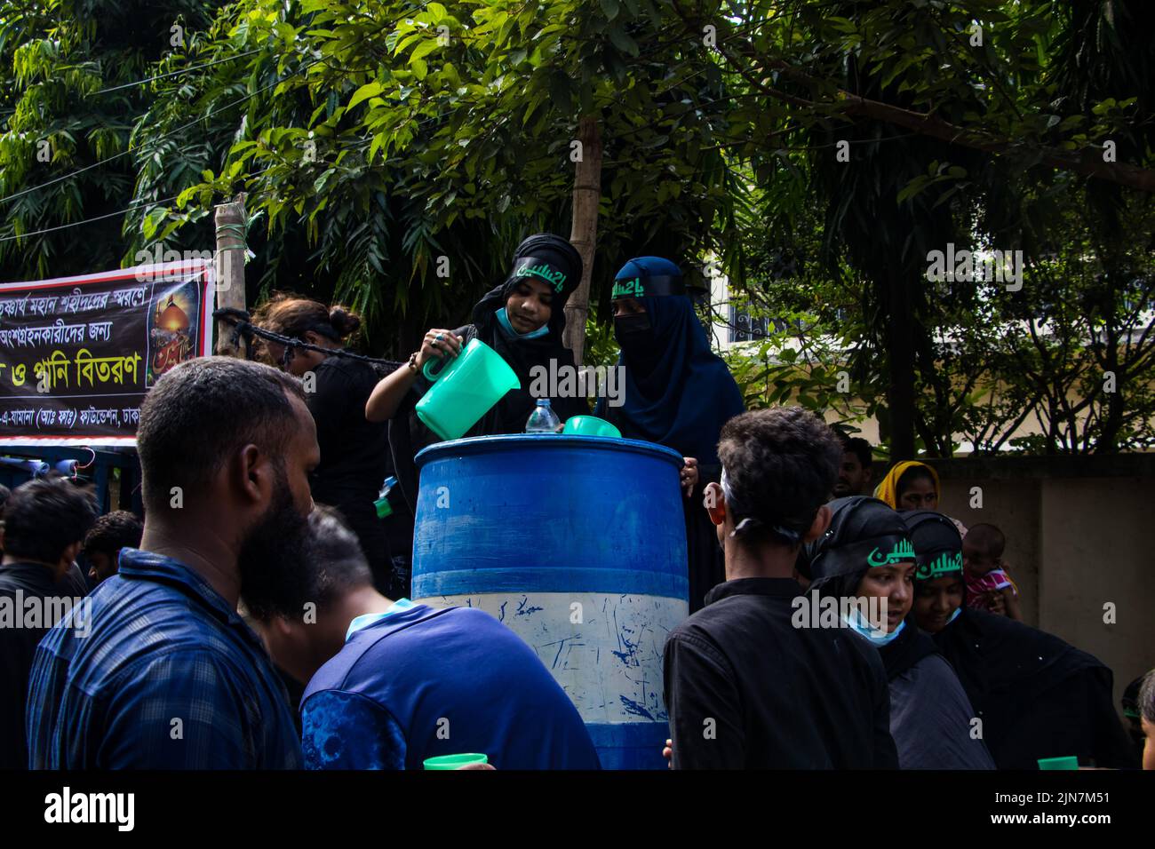 Bangladeshi Shia Muslims march and carry the flags and Tazia during a ...