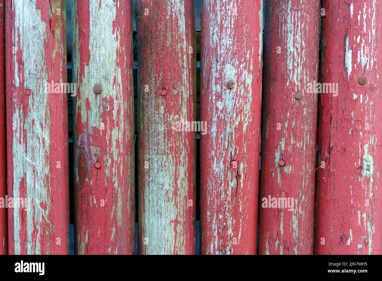 Old red fence made of vertical logs. Backgrounds and textures Stock ...