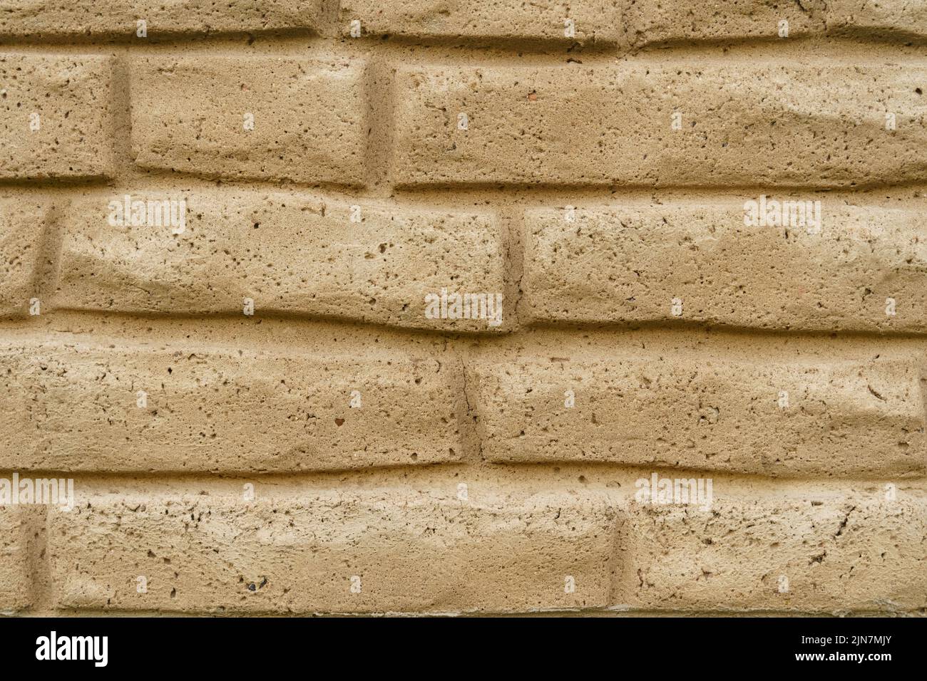 Cream background texture with concrete uneven color of beige bricks ...
