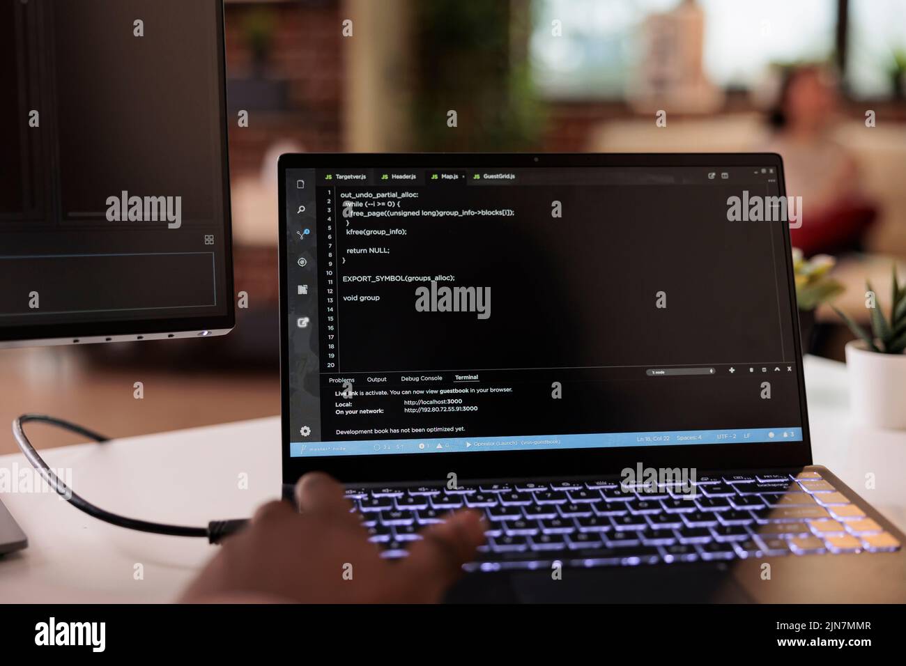 Male Programmer Using Coding Encryption Interface App On Laptop Screen Working With Binary Code