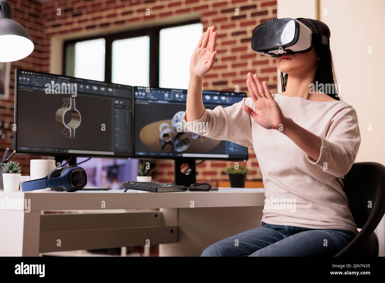 Engineer using vr glasses to manufacture gears product with virtual ...