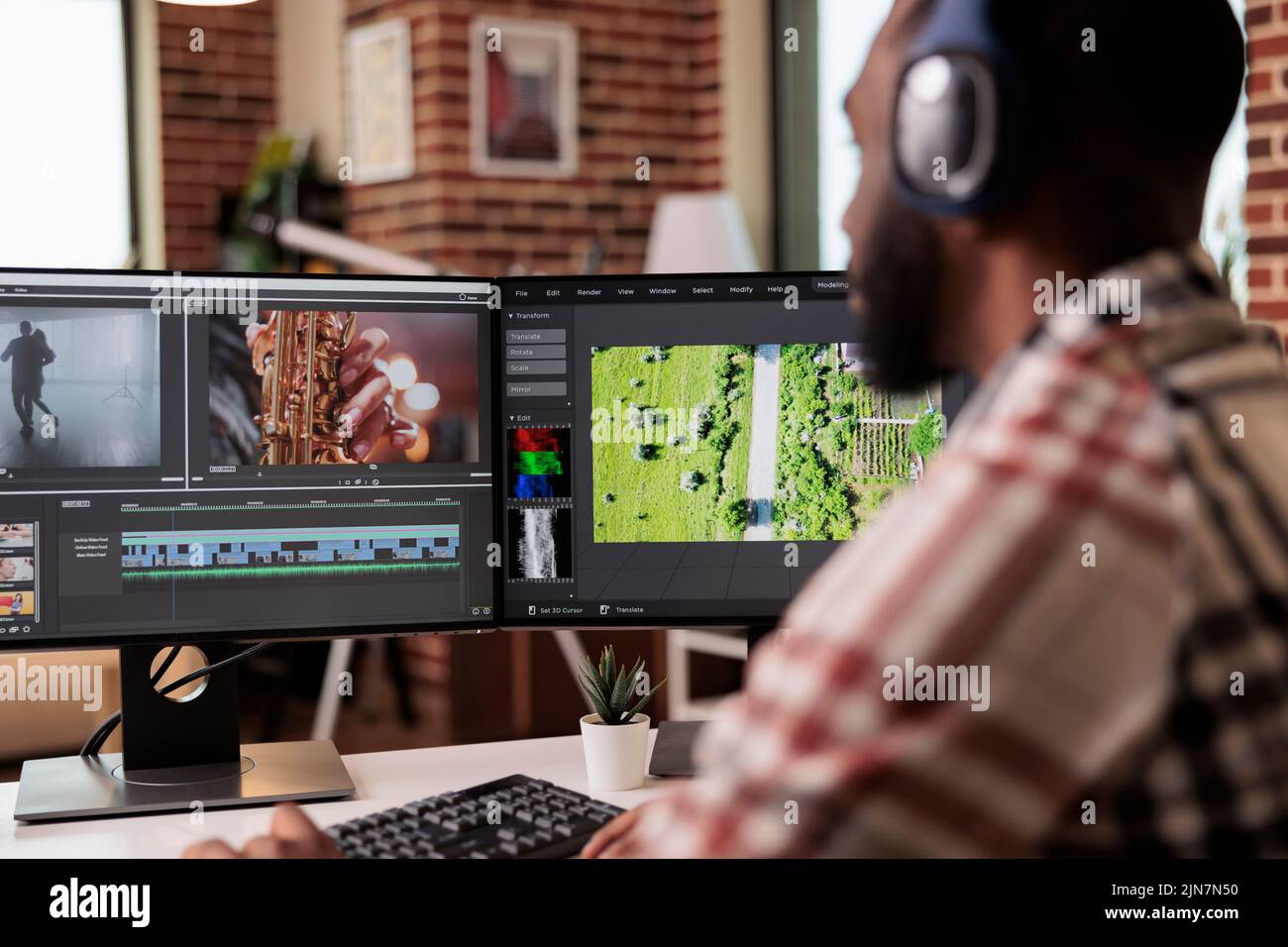 Graphic designer editing footage on software, working to edit video ...
