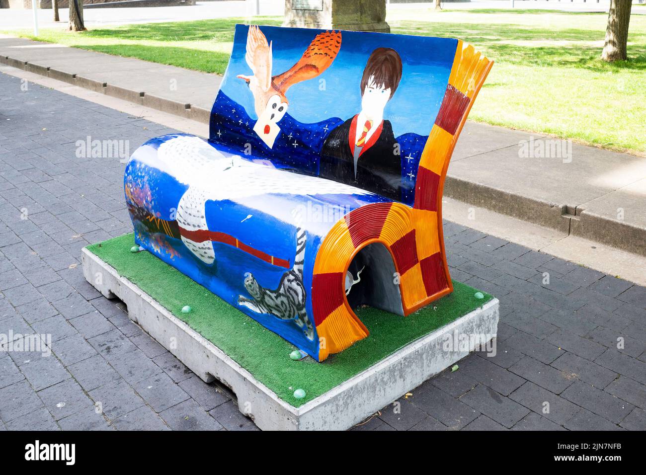 A public seat in the form of an open book outside the public library in ...