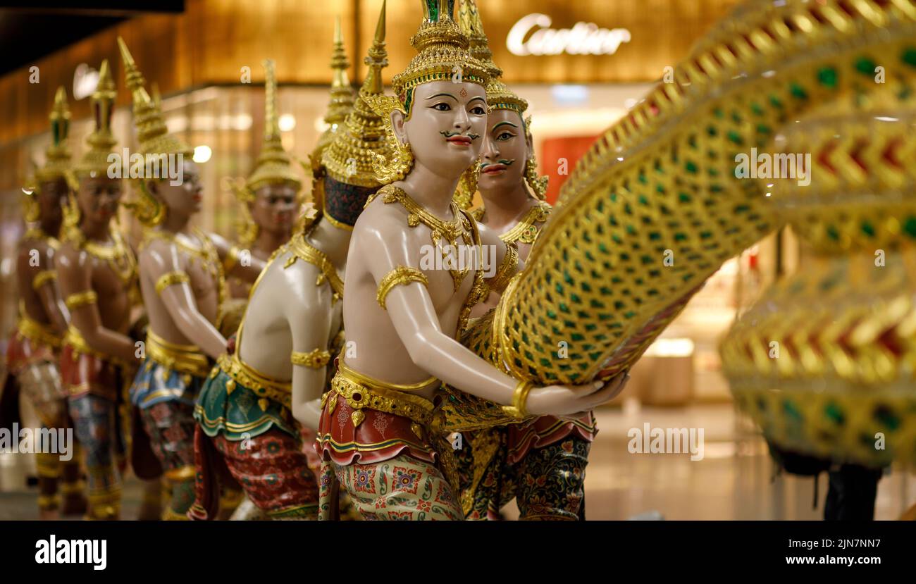 Close up of Devas (gods) pulling on a naga (snake) part of a statue in ...